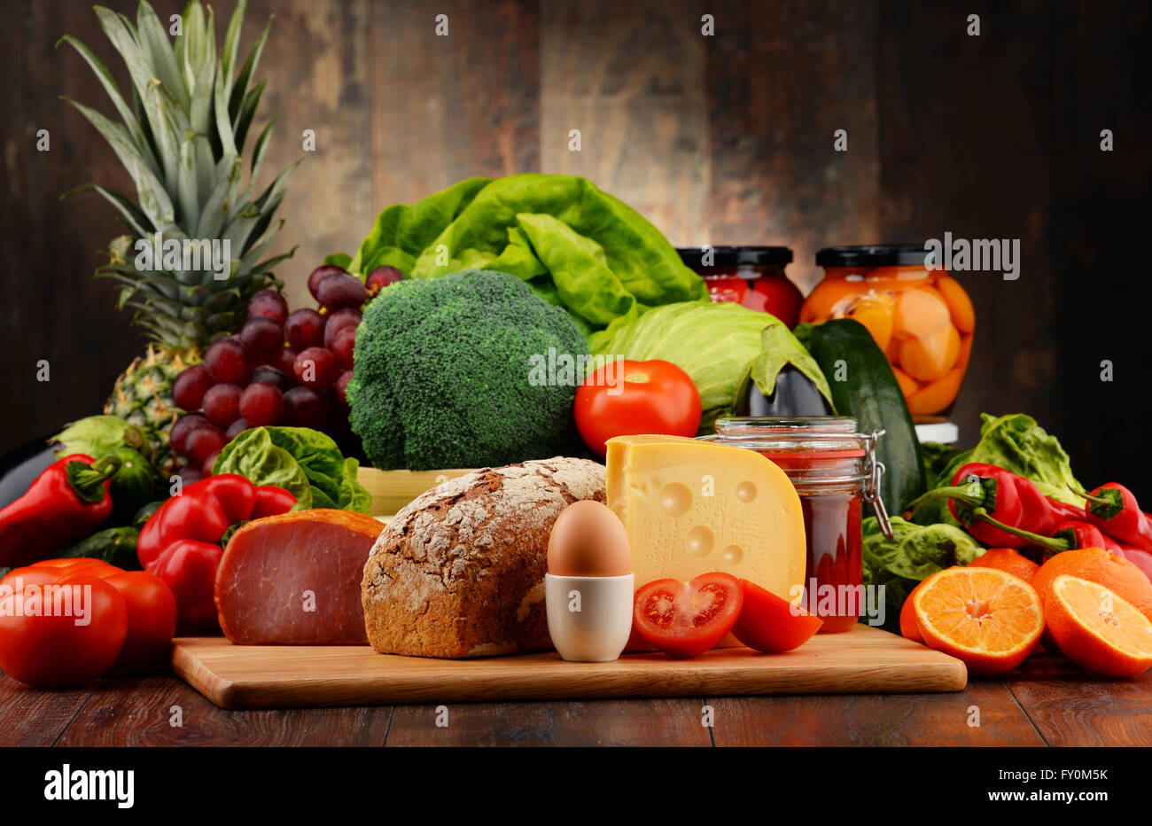 Variety of organic food including vegetables fruit bread dairy and meat ...