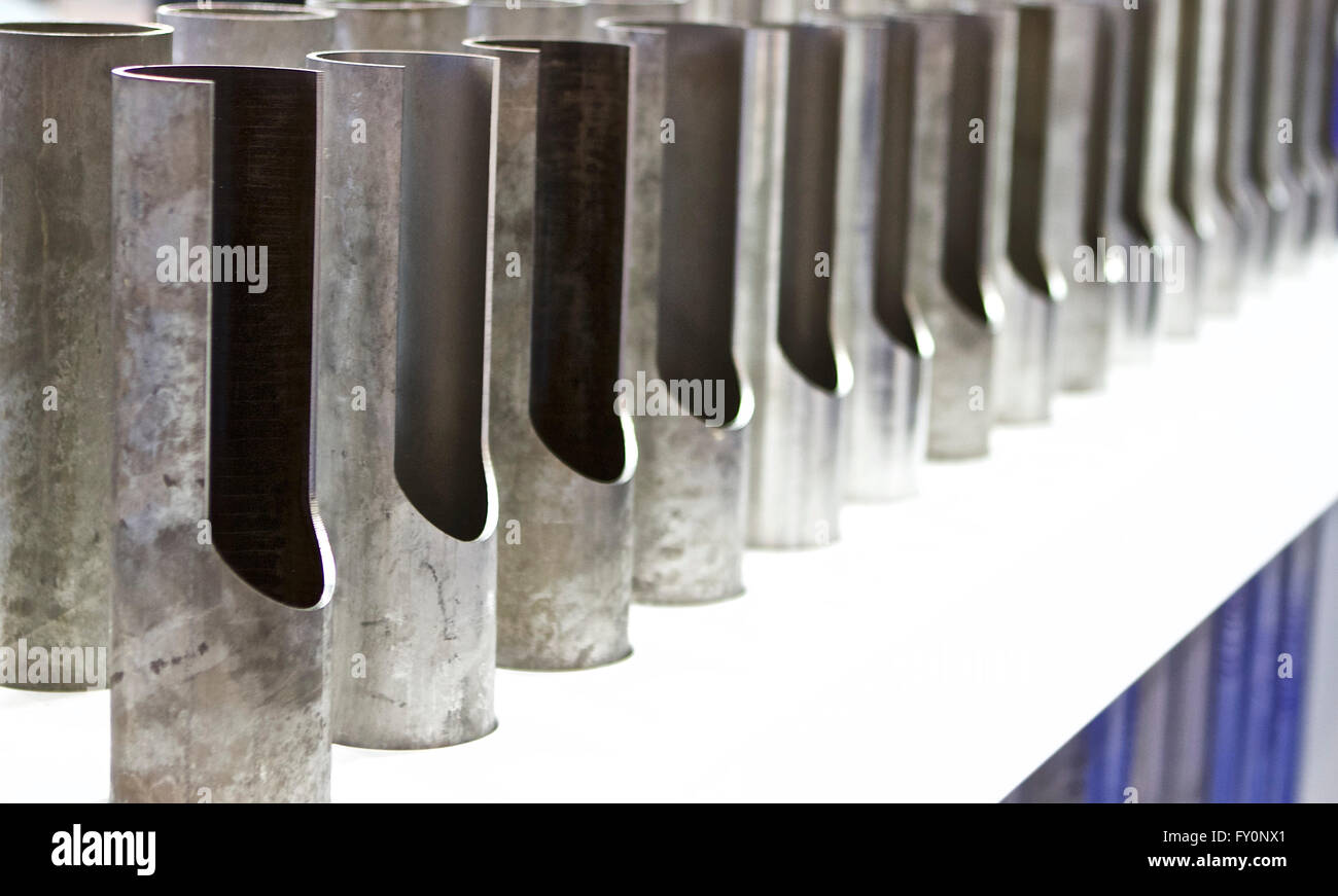 Tubes with shaped cutout at the end installation Stock Photo - Alamy
