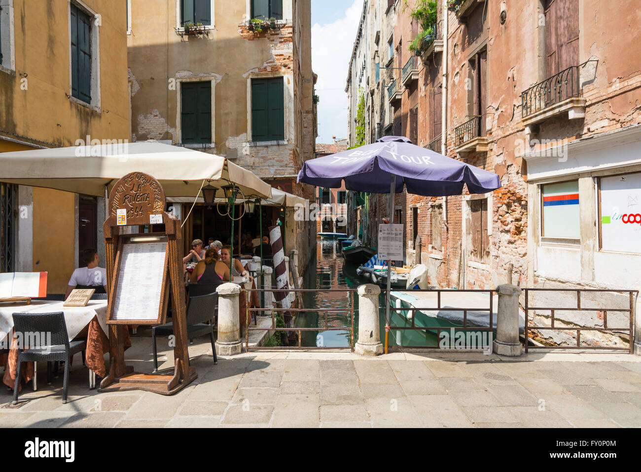 Venice,Italy-August 12,2014:tourists stop to eat in a hidden restaurant ...