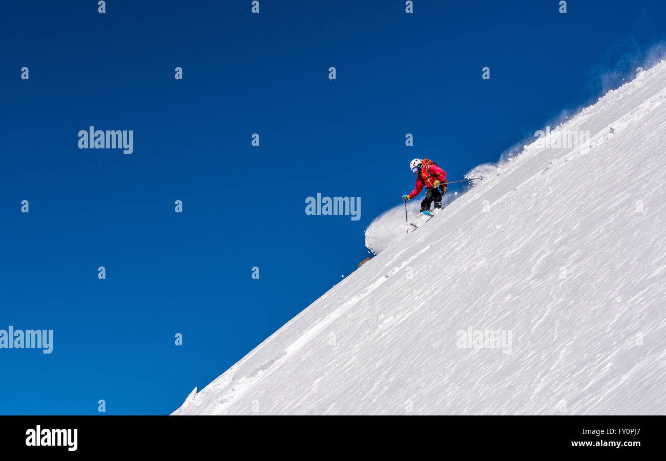 Ski mountaineer descending from the summit of the "Super Gully" on Lost ...