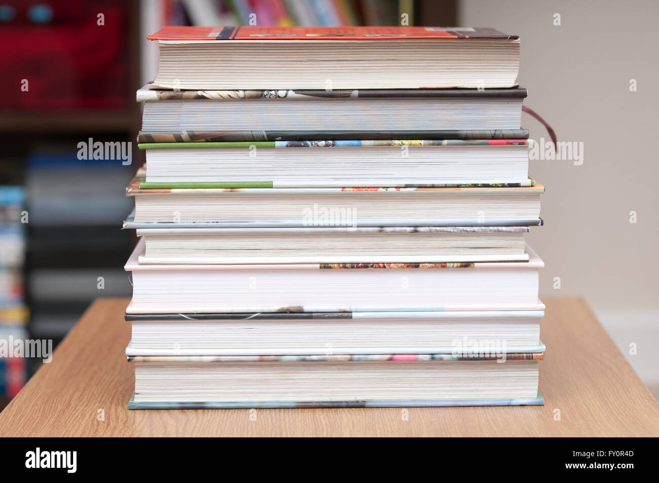 Stack of books with the pages facing towards the camera Stock Photo - Alamy