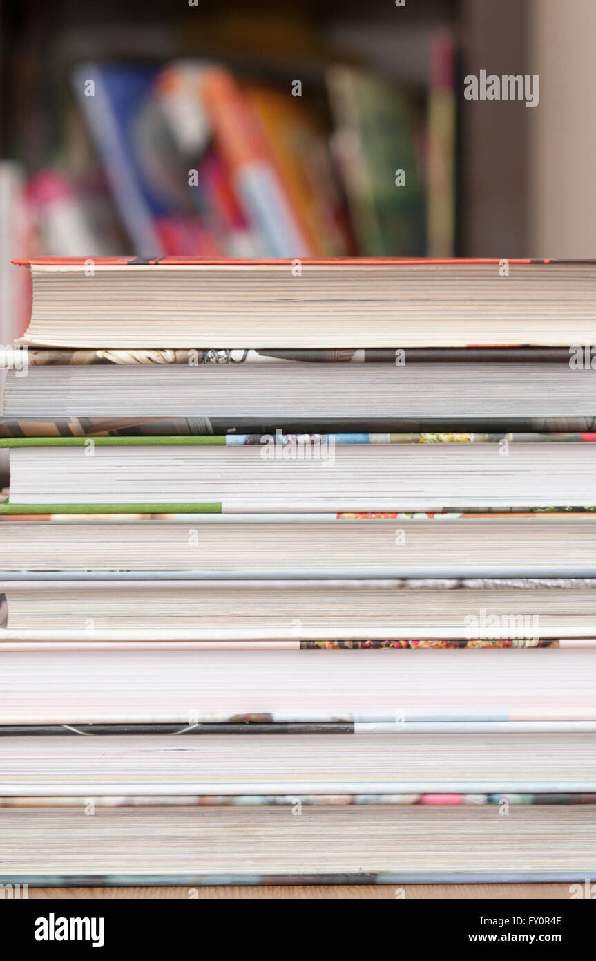 Stack of books with the pages facing towards the camera Stock Photo - Alamy