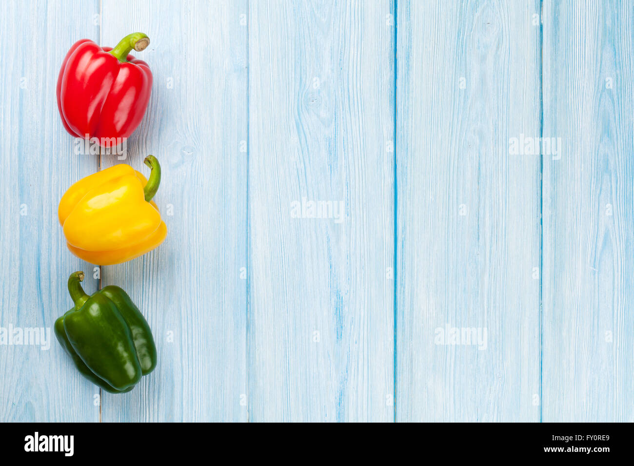 Colorful bell peppers on wooden table. Top view with copy space Stock ...