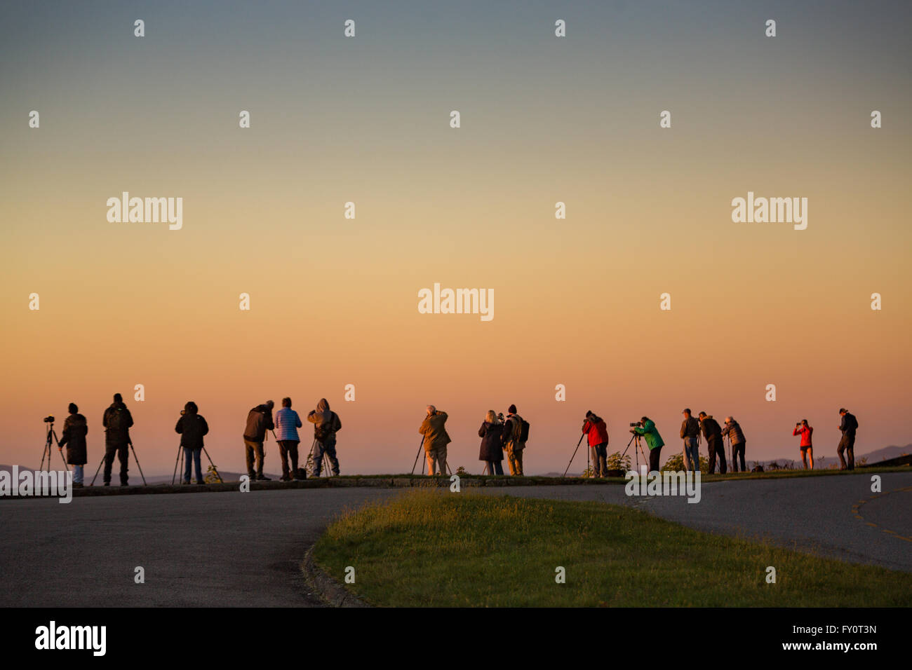 Photographers gather to photograph the sunrise over the Blue Ridge ...