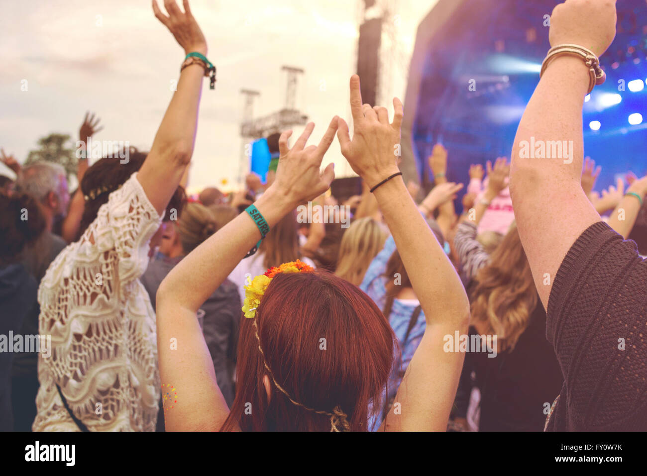 Concert audience with raised arms Stock Photo - Alamy