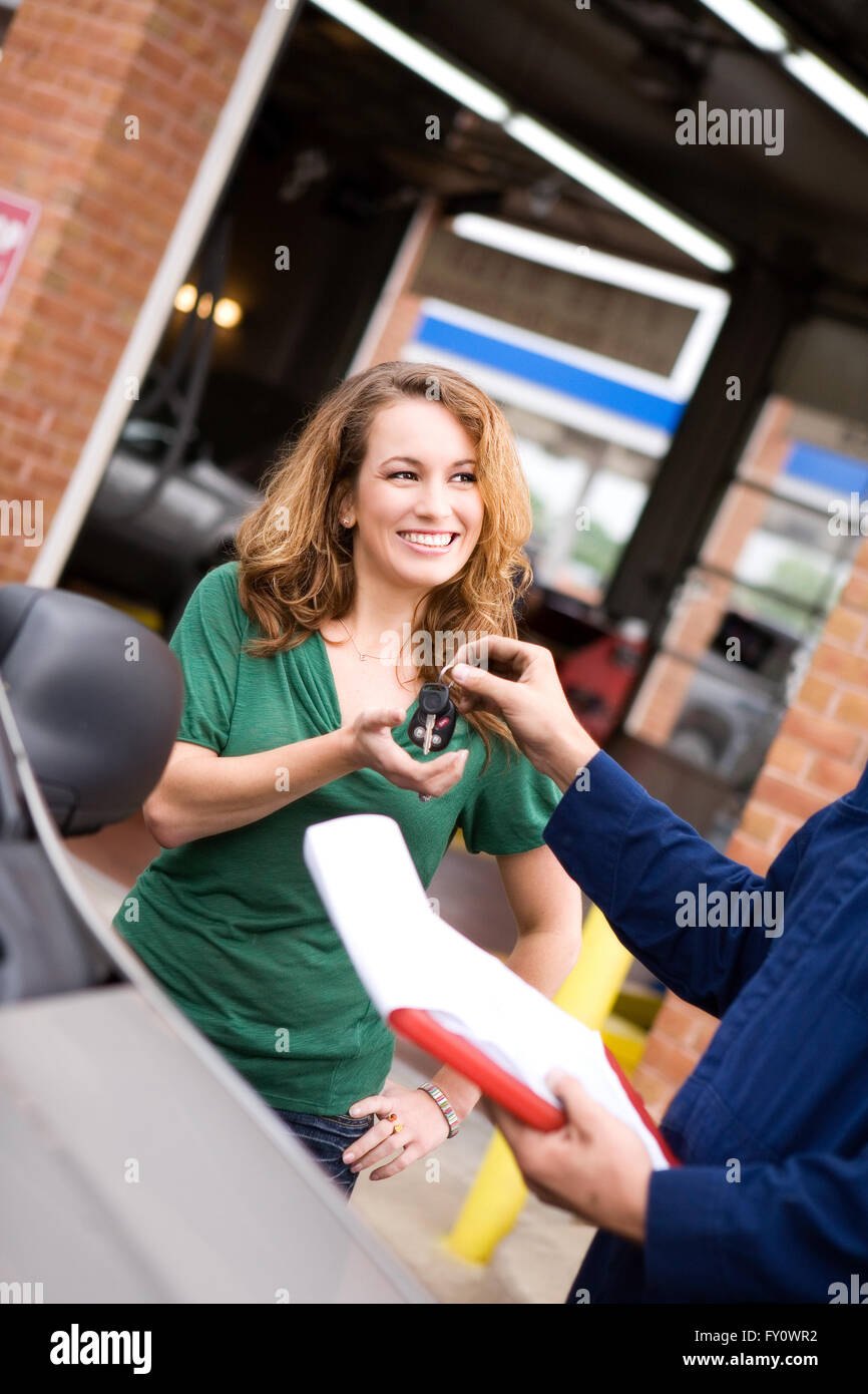 Extensive series of a woman who has taken her car to the auto service ...
