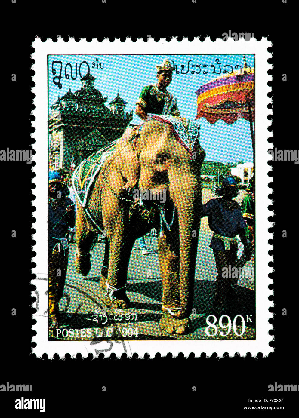 Postage stamp from Laos depicting an Asian elephant being ridden Stock ...