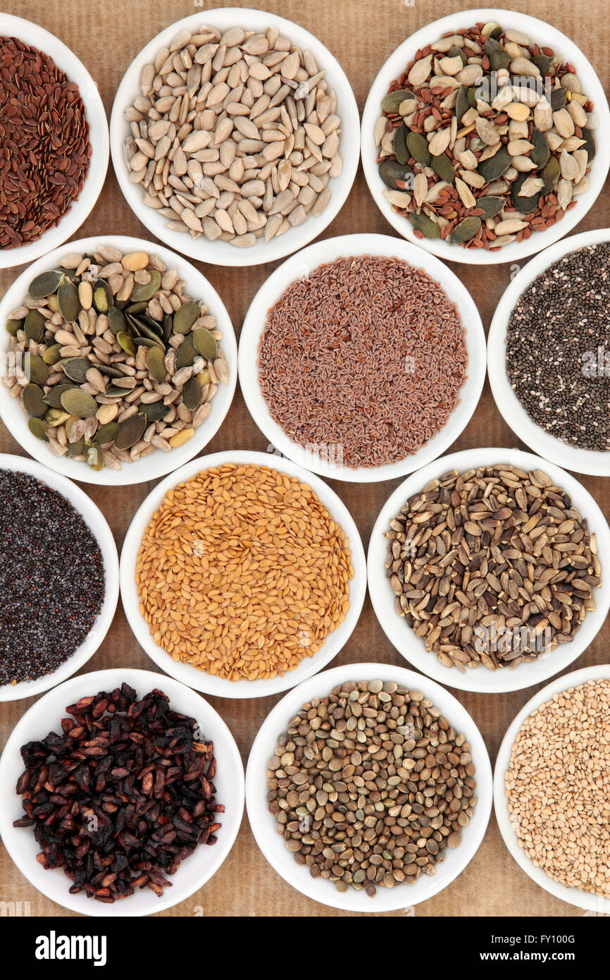 Healthy seed food selection in white porcelain bowls Stock Photo - Alamy