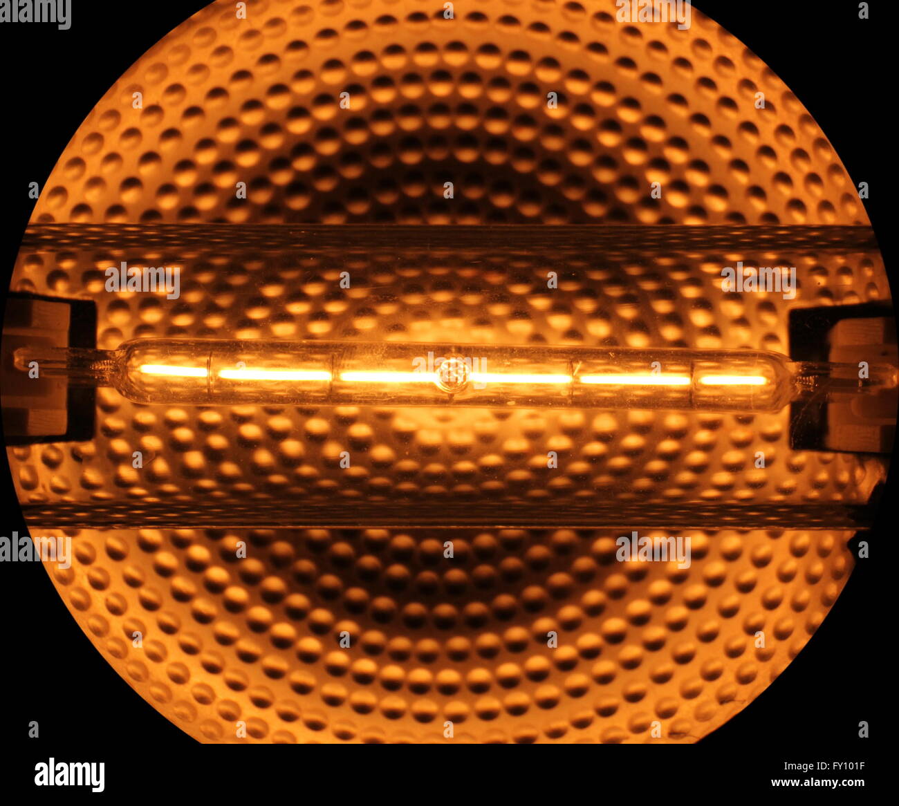 Halogen tube lamp with reflecting background Stock Photo - Alamy