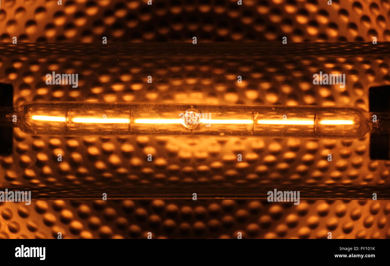 Halogen tube lamp with reflecting background Stock Photo - Alamy