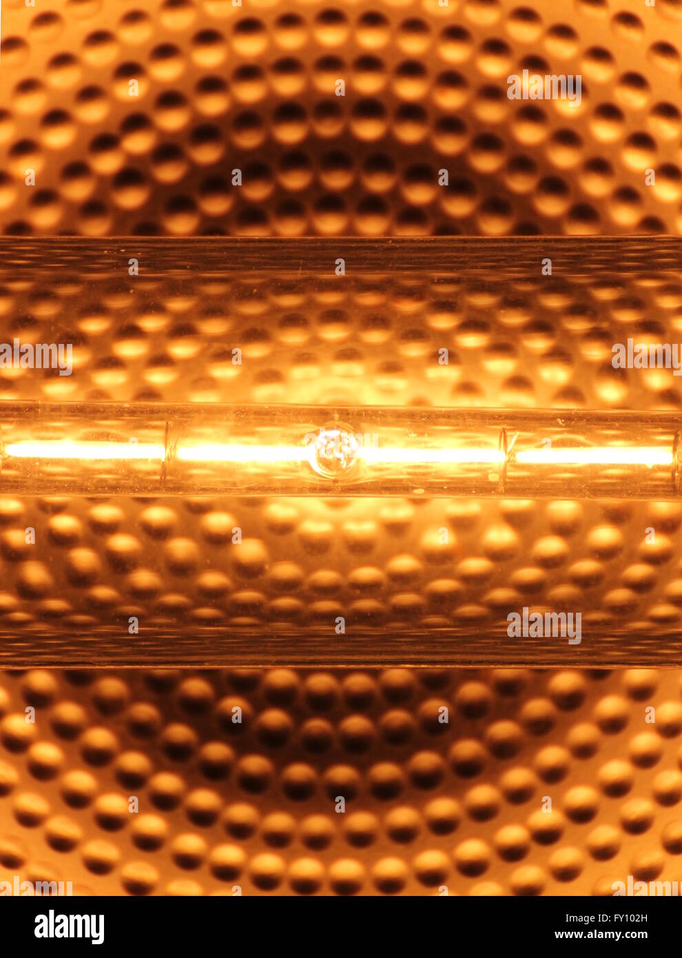 Halogen tube lamp with reflecting background Stock Photo - Alamy