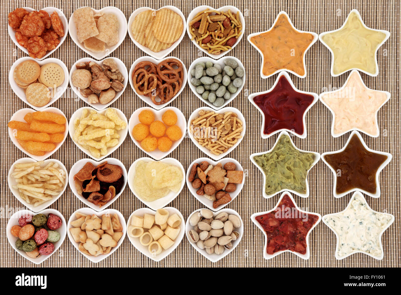 Crisp and dip party food selection in heart and star shaped porcelain ...