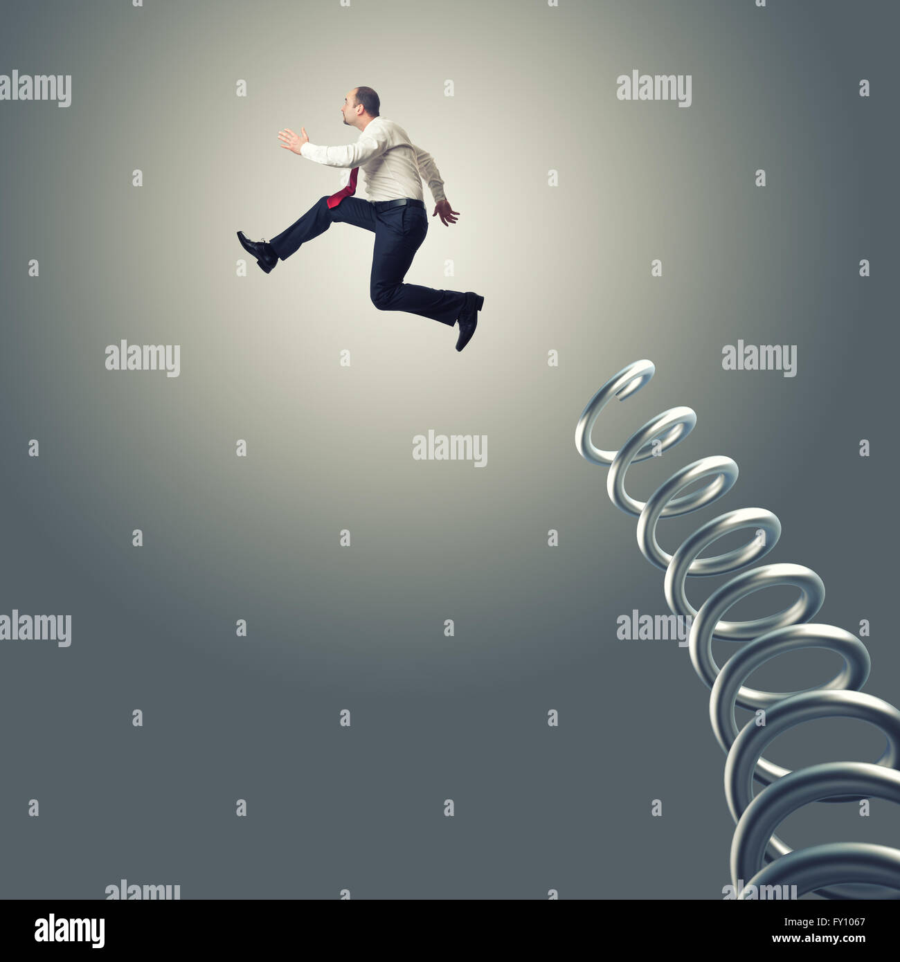 jumping man and metal springer Stock Photo - Alamy