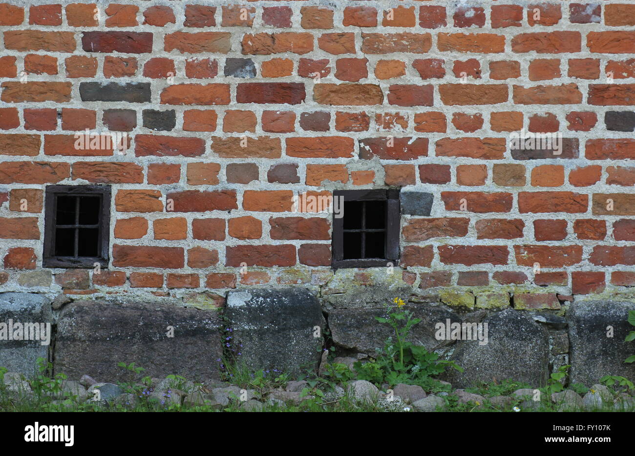 Wall with small windows at the basement of a church building near ...