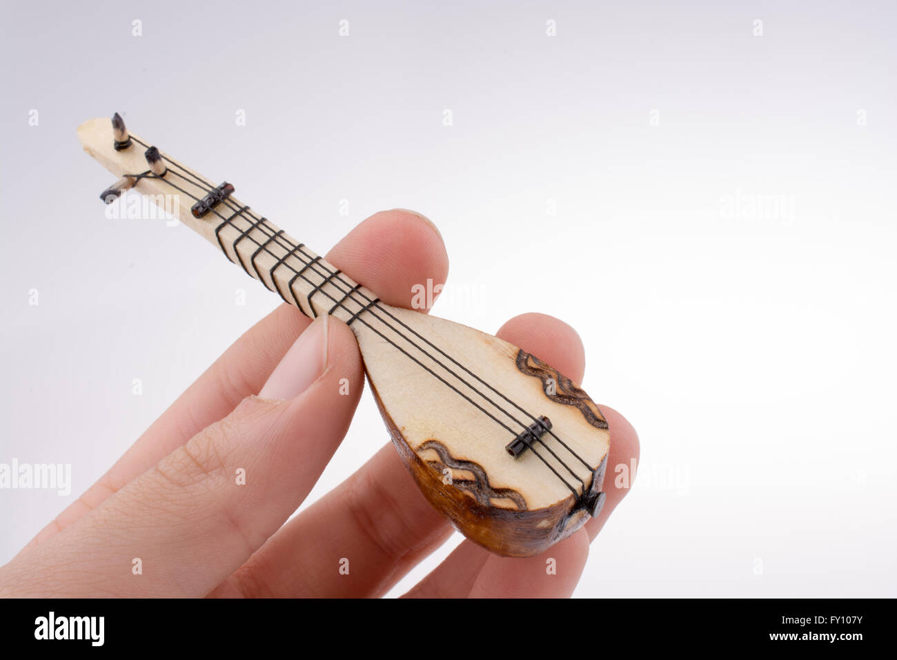 Hand holding the classic turkish instrument Saz Stock Photo - Alamy
