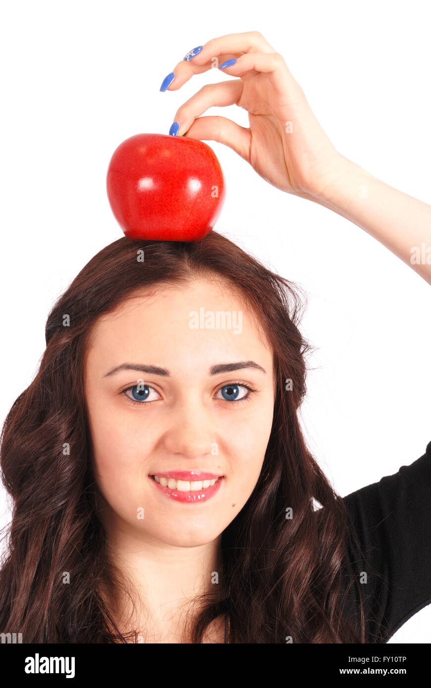 Teen girl holds an apple on her head Stock Photo - Alamy