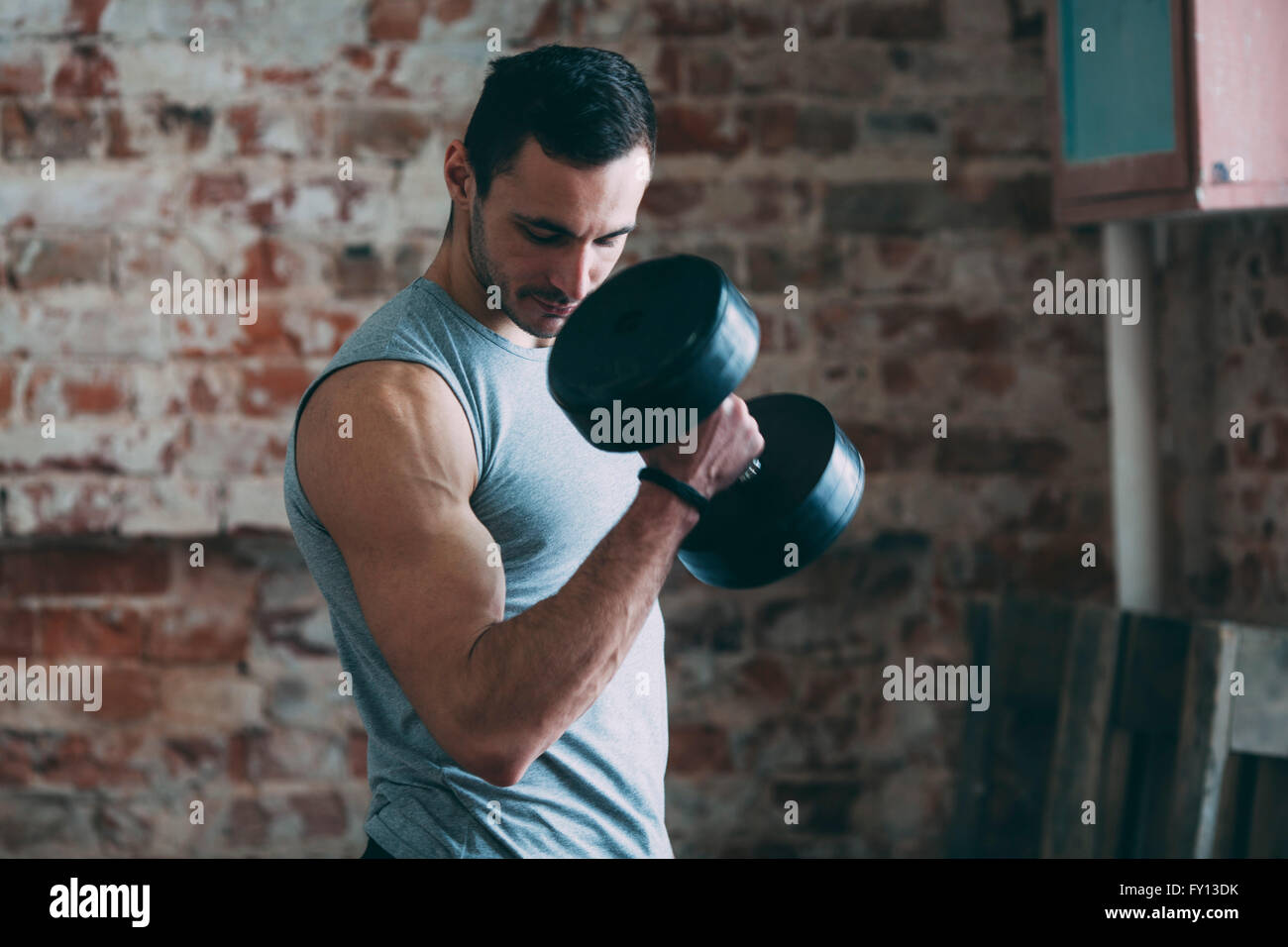 Dumbbell man hi-res stock photography and images - Alamy