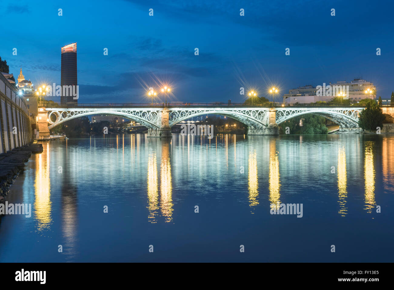 Guadalquivir river, Puente de Isabel, bridge, twilight, Seville ...