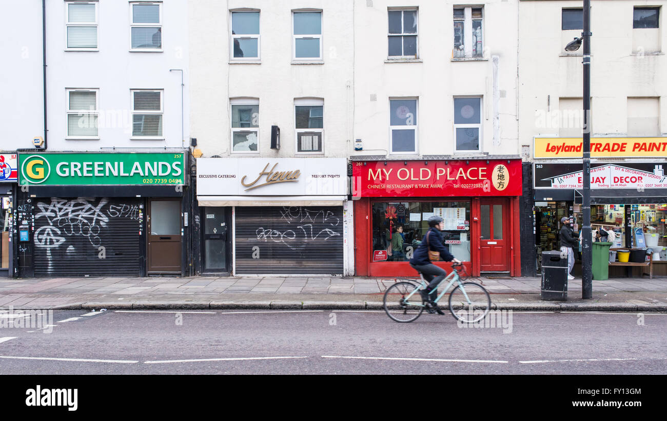 Typical street with small independent retail shops in London East End ...