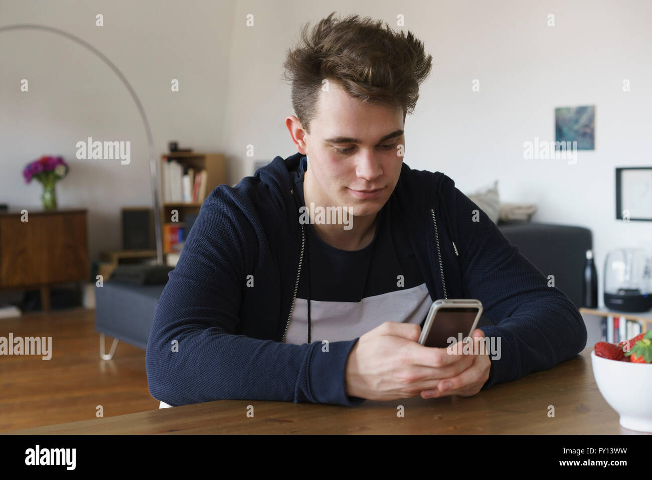 Person on the phone at home hi-res stock photography and images - Alamy