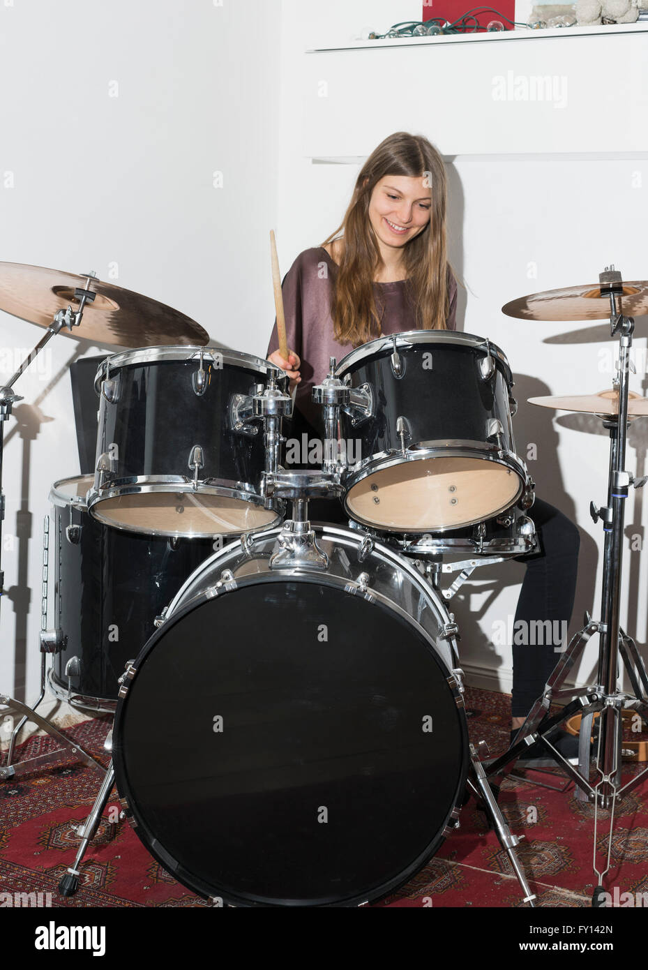 Woman playing the drums hi-res stock photography and images - Alamy