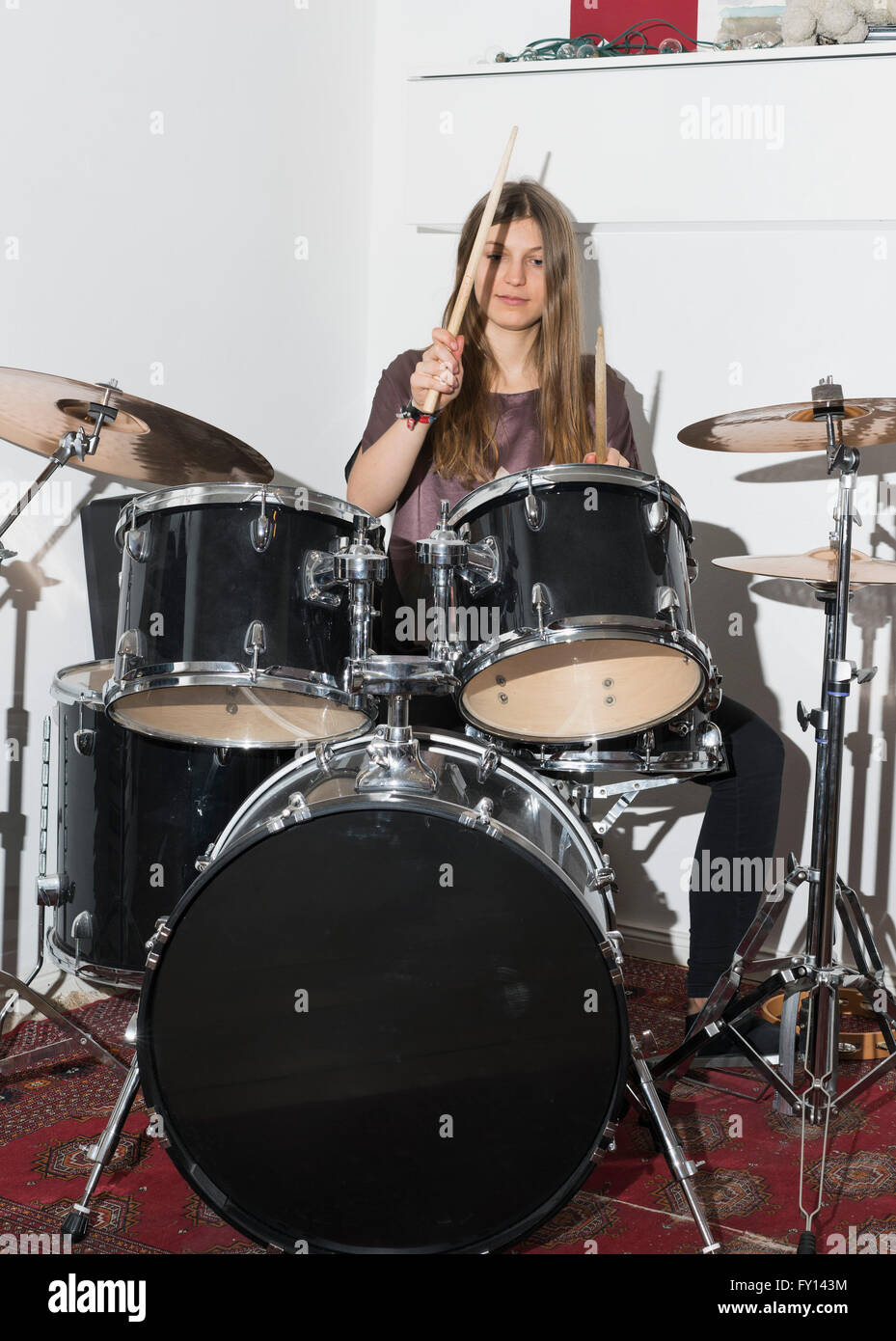 Woman playing drum smiling hi-res stock photography and images - Alamy