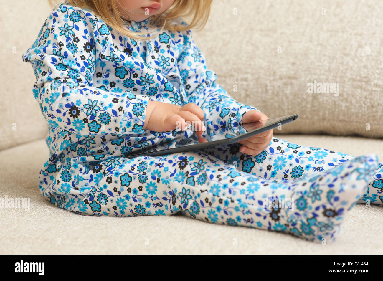Baby with tablet computer Stock Photo - Alamy