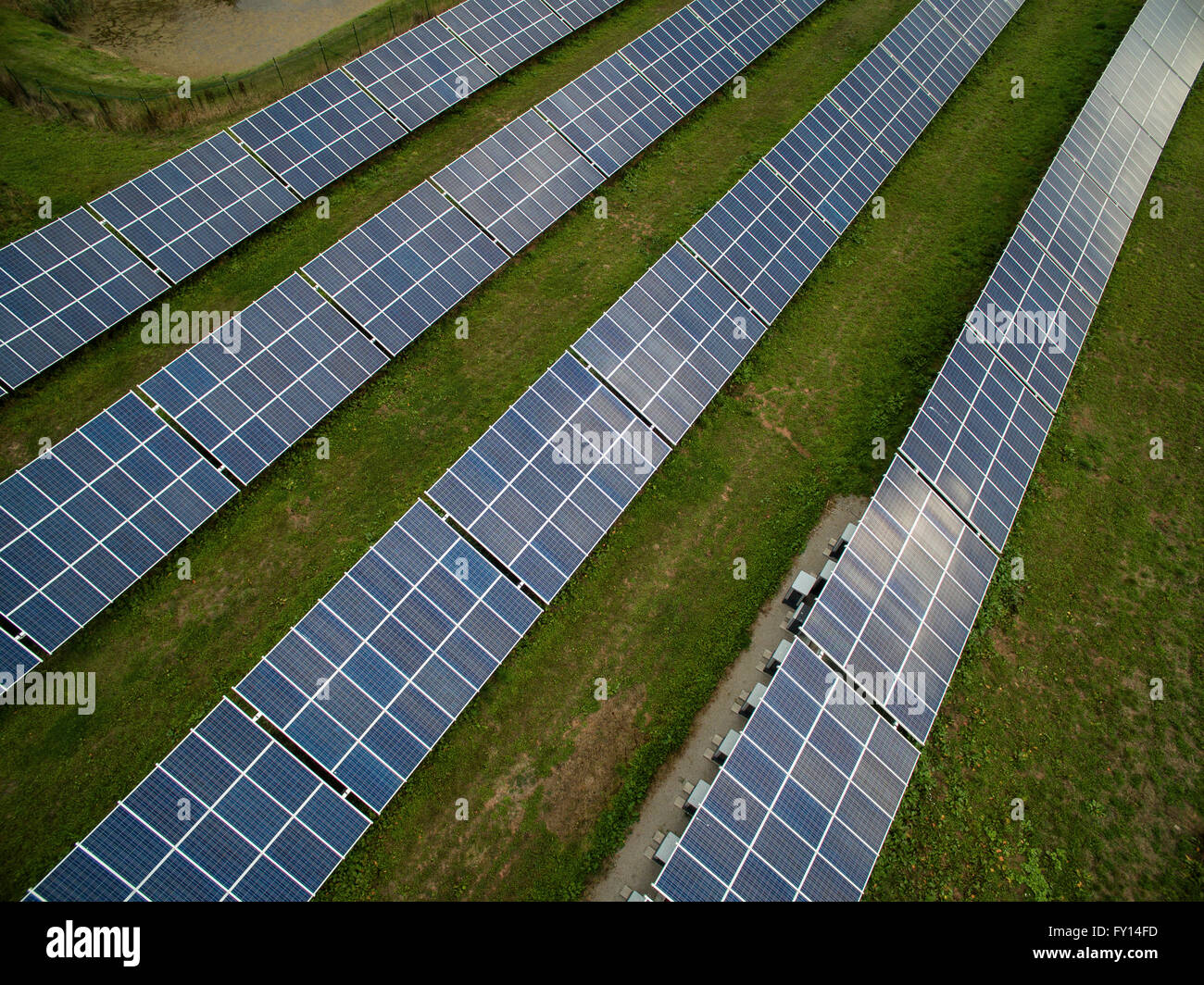 Solar panels on field Stock Photo - Alamy