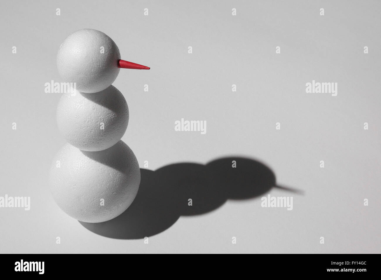 Snowman and its shadow over white background Stock Photo - Alamy