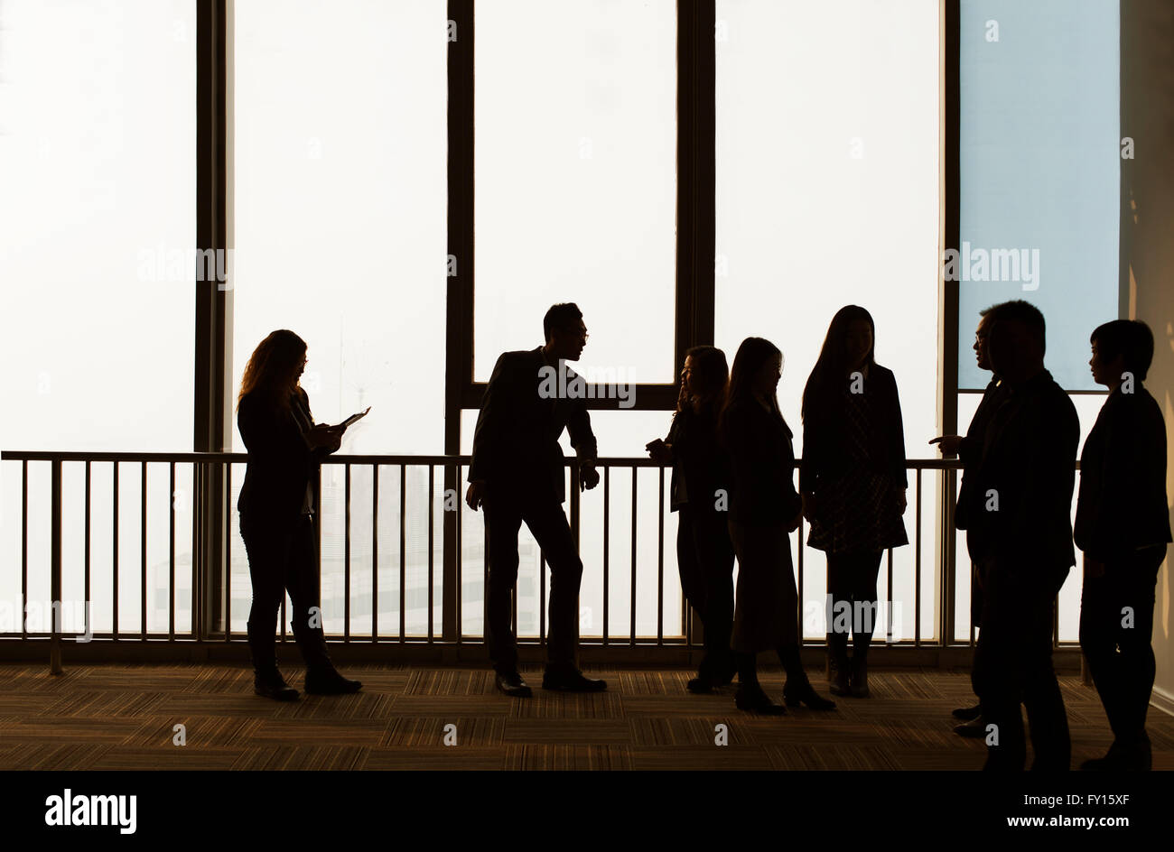 group of people in front of city window Stock Photo - Alamy