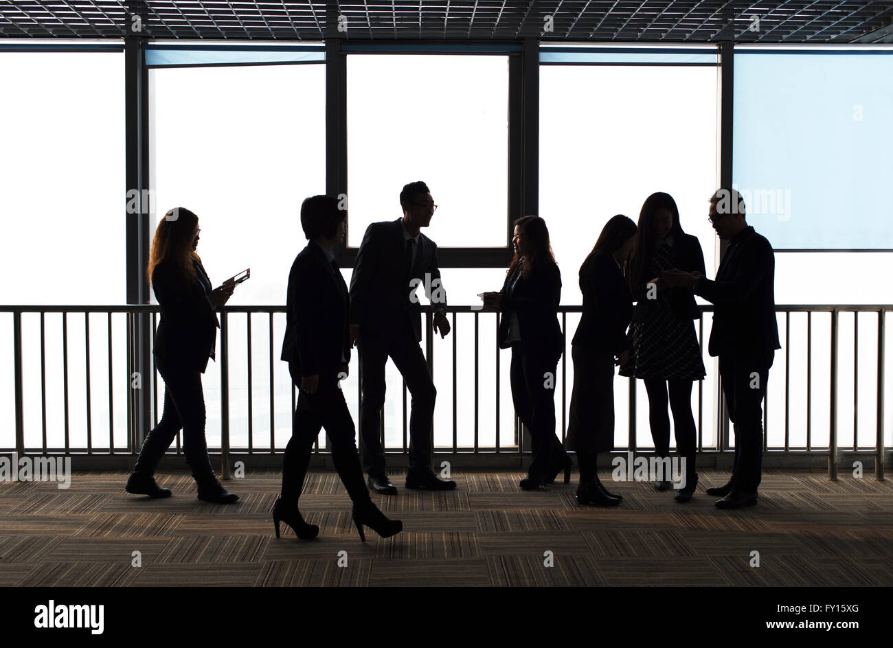 group of people in front of city window Stock Photo - Alamy