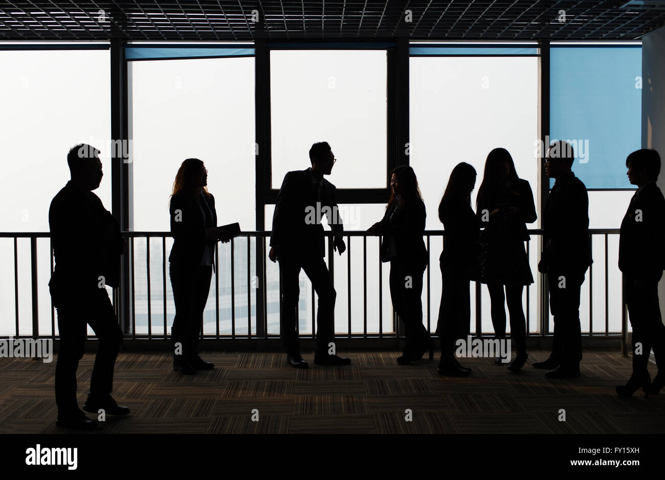 group of people in front of city window Stock Photo - Alamy