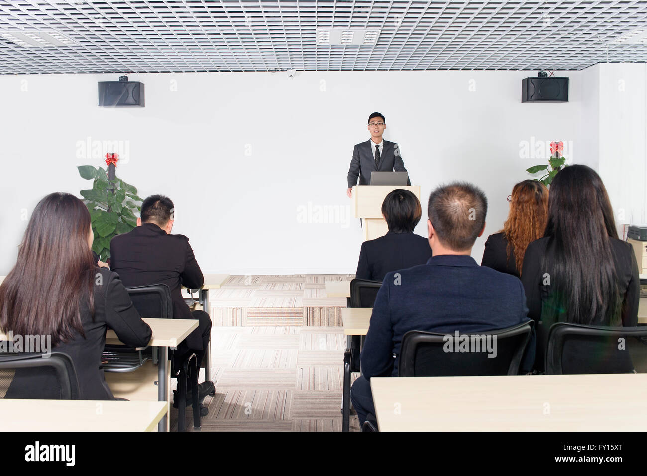 business man giving a conference in a room Stock Photo - Alamy