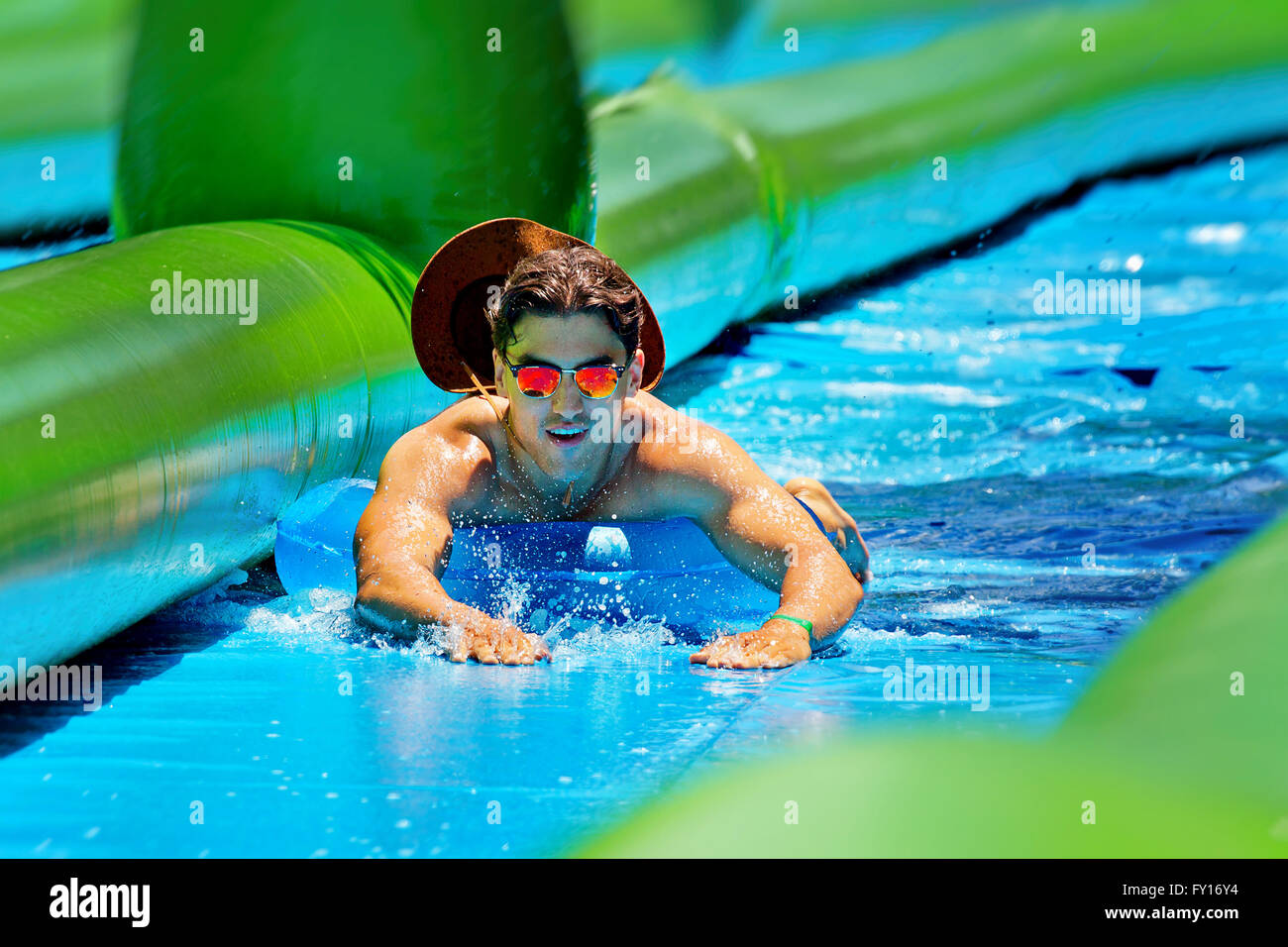 Man water slide hi-res stock photography and images - Alamy