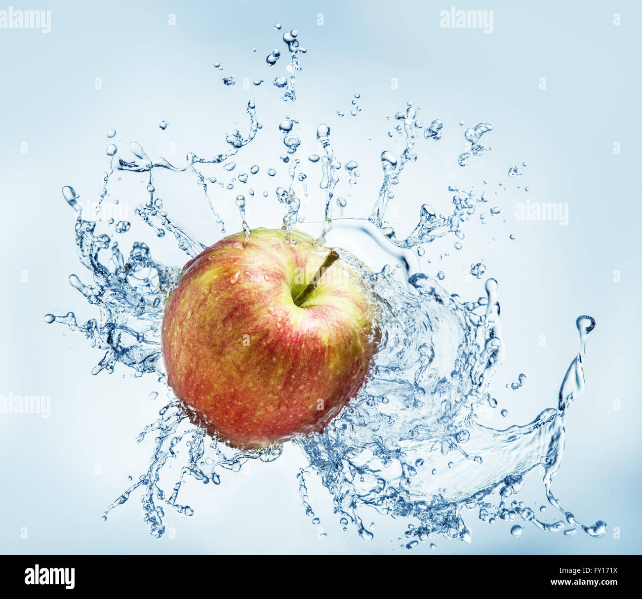 Apple fruit surrounded with water splash Stock Photo - Alamy
