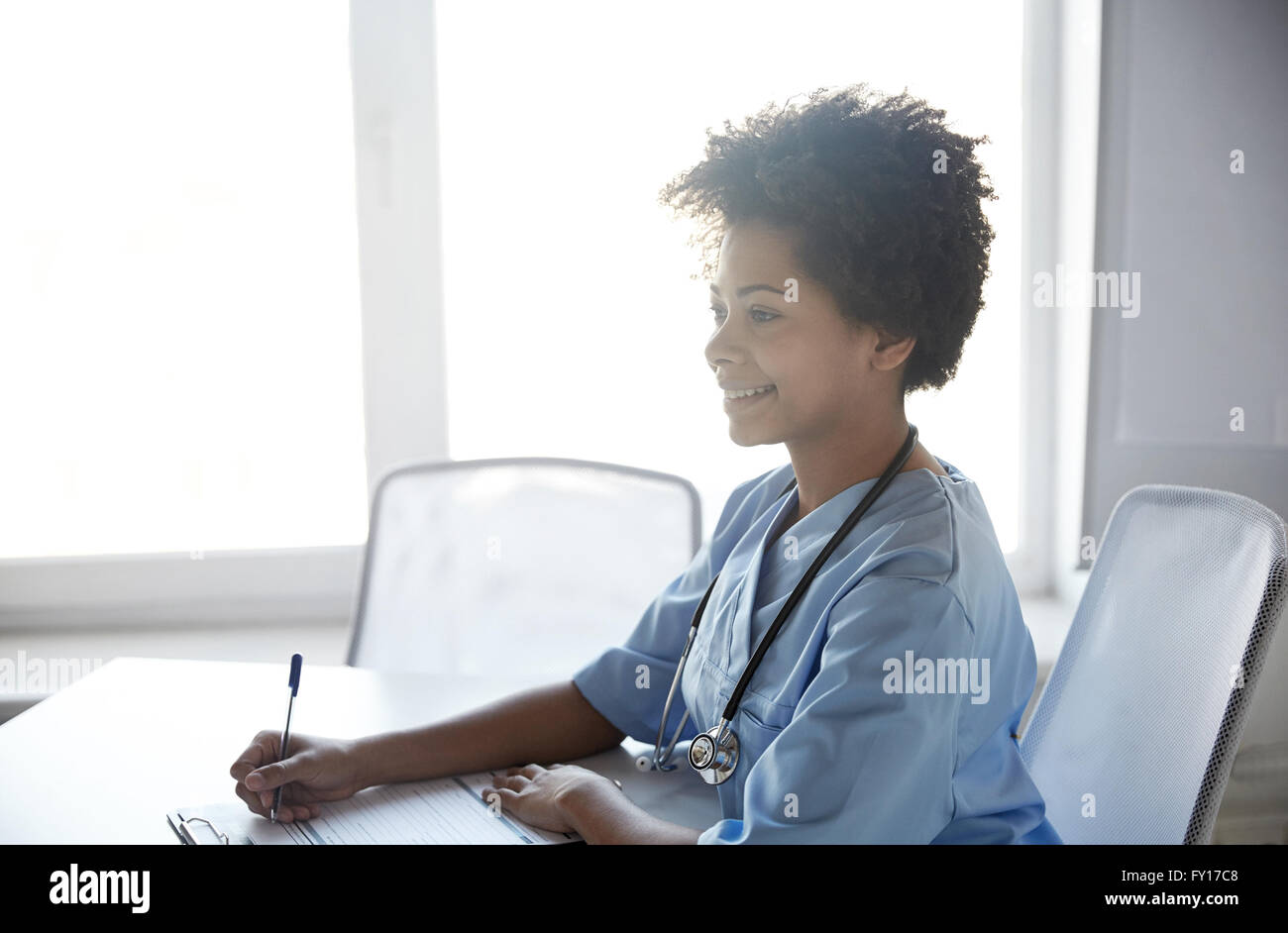 Hospital nurse making notes hi-res stock photography and images - Alamy