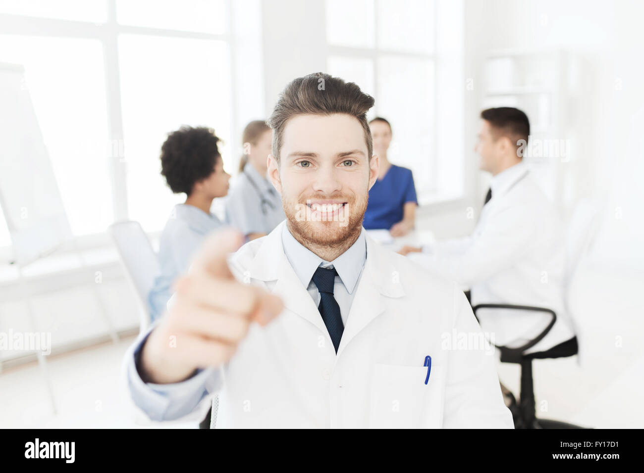 happy doctor over group of medics at hospital Stock Photo - Alamy