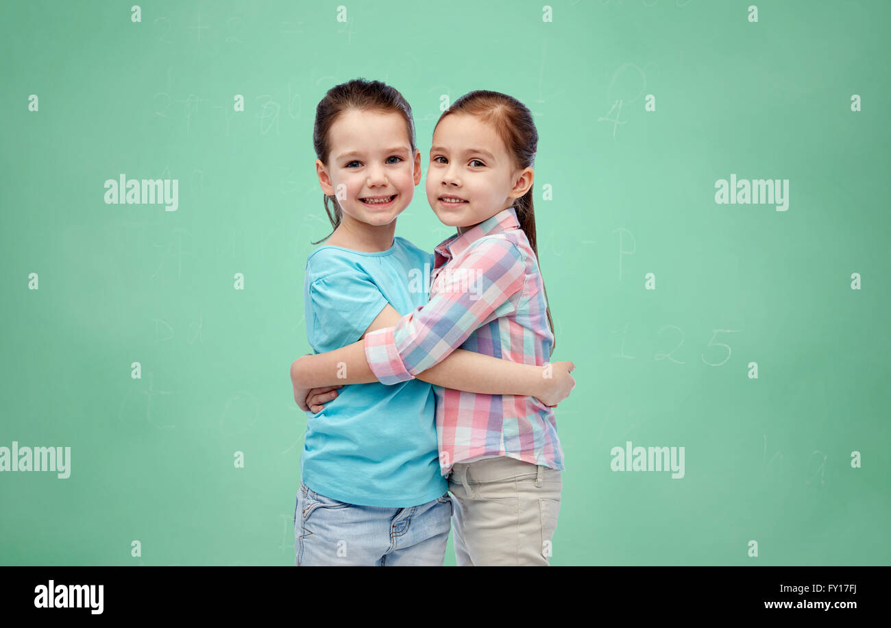 Two friends hugging at school hi-res stock photography and images - Alamy