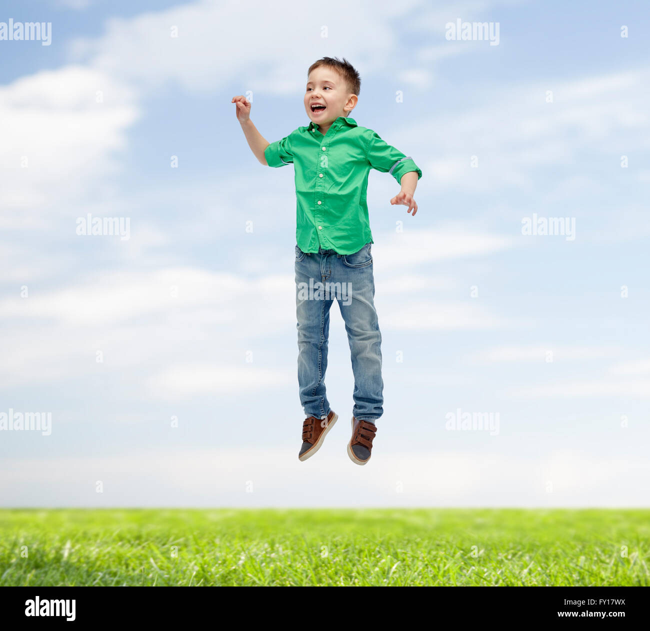 happy little boy jumping in air Stock Photo - Alamy