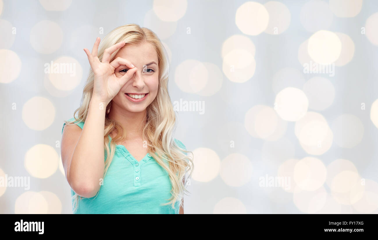 young woman making ok hand gesture Stock Photo - Alamy