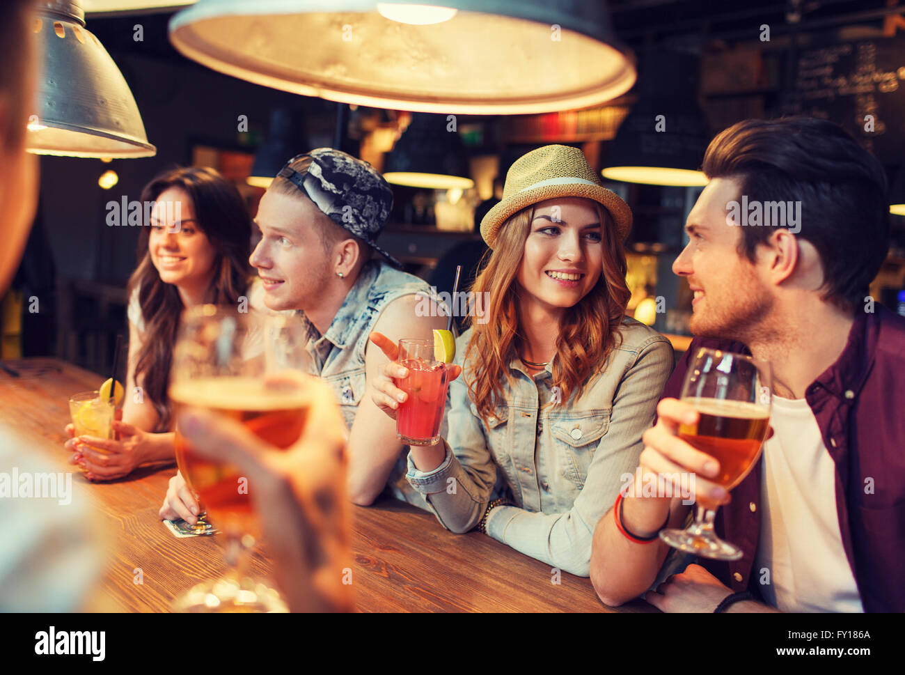 Group friends having drinks bar hi-res stock photography and images - Alamy