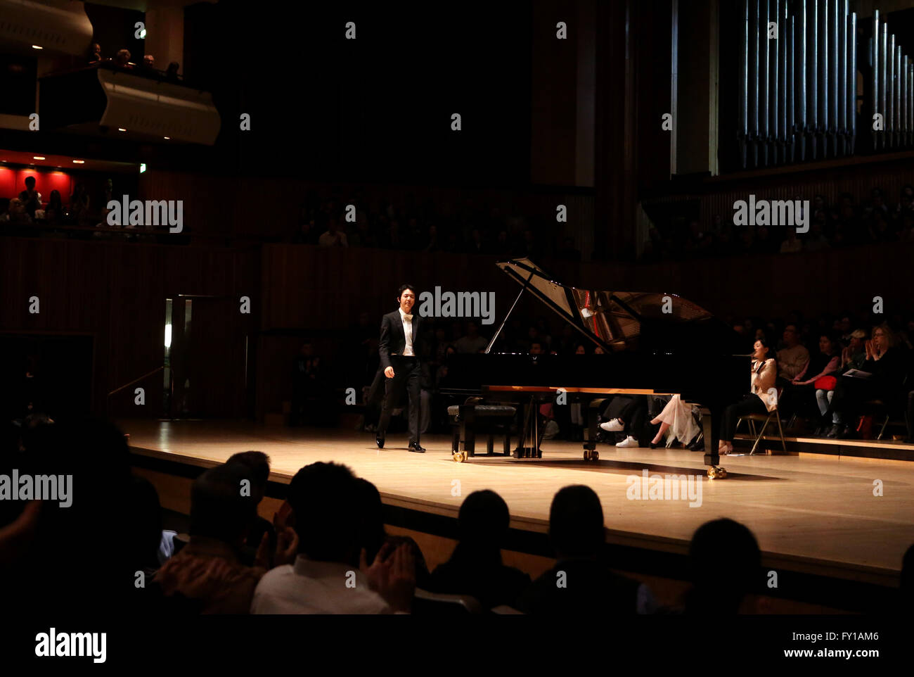 London, Britain. 19th Apr, 2016. Pianist Li Yundi walks to perform ...