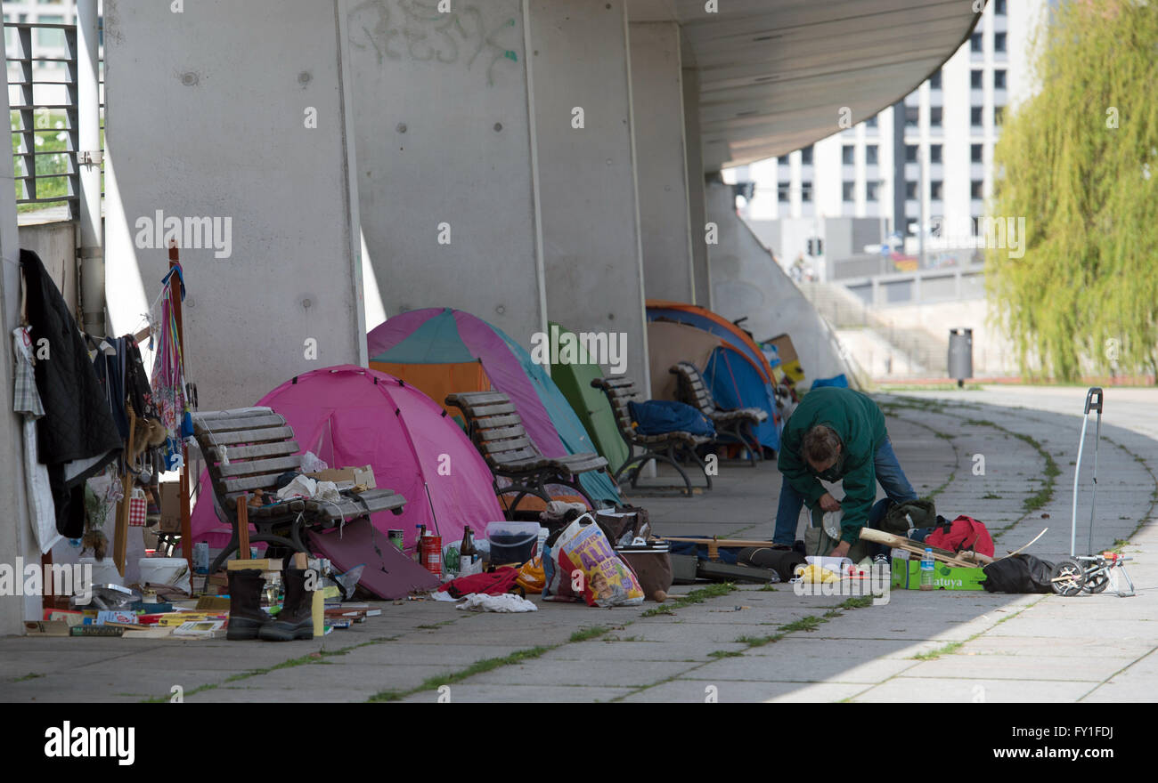 Homeless people have pitched their tents under a bridge in the ...