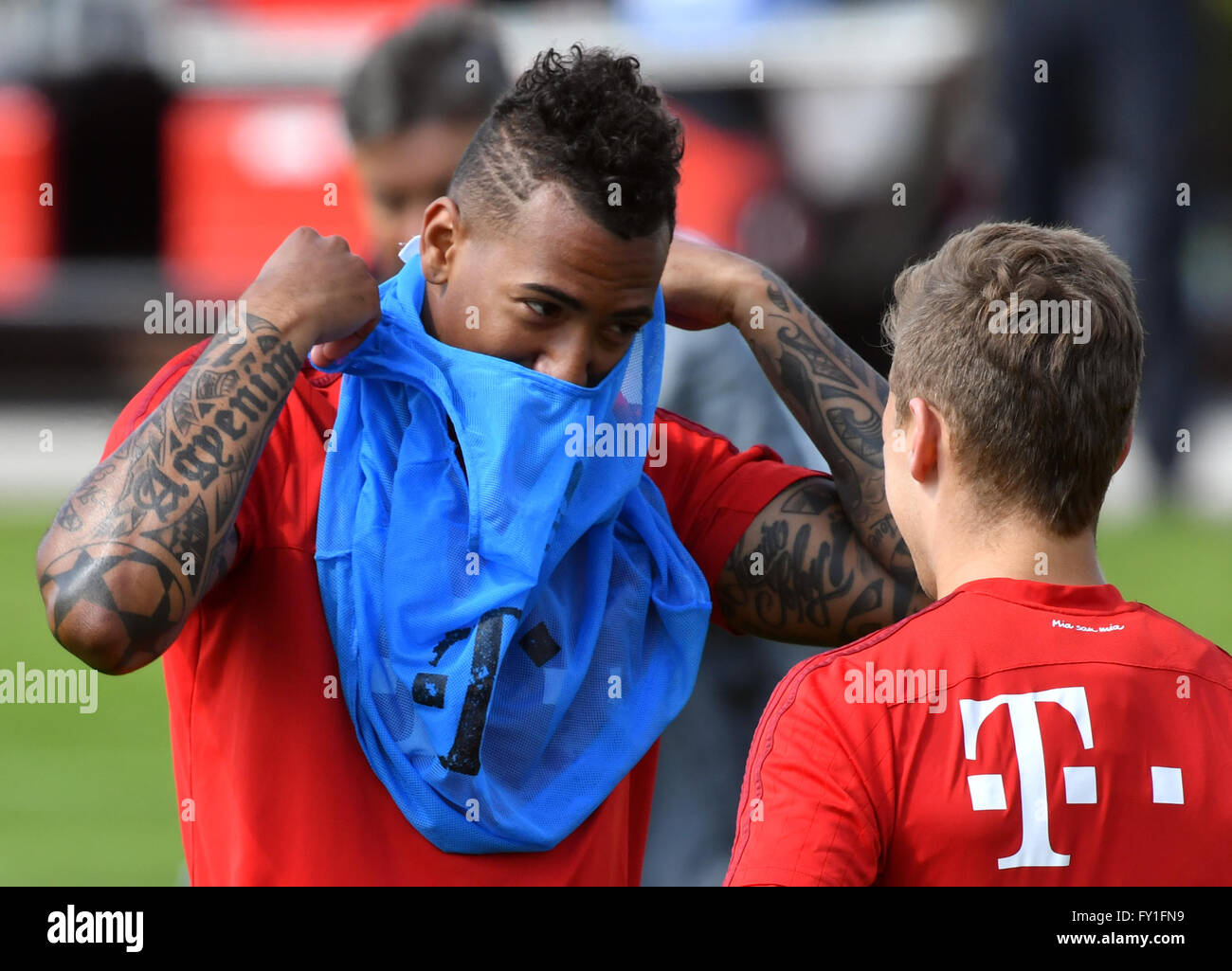 Munich, Germany. 20th Apr, 2016. Jerome Boateng (L) speaks with a ...