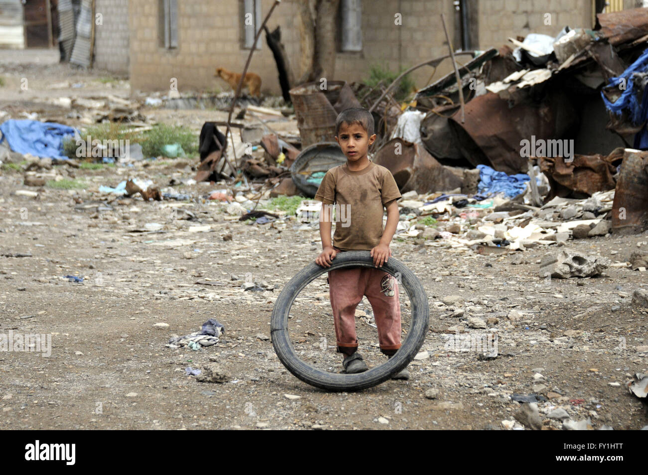 Sanaa, Yemen. 20th Apr, 2016. A child from a poor family stands outside ...