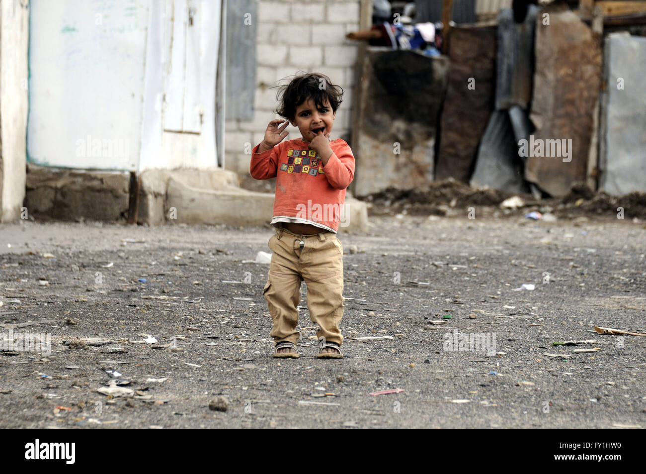 Sanaa, Yemen. 20th Apr, 2016. A child from a poor family stands outside ...
