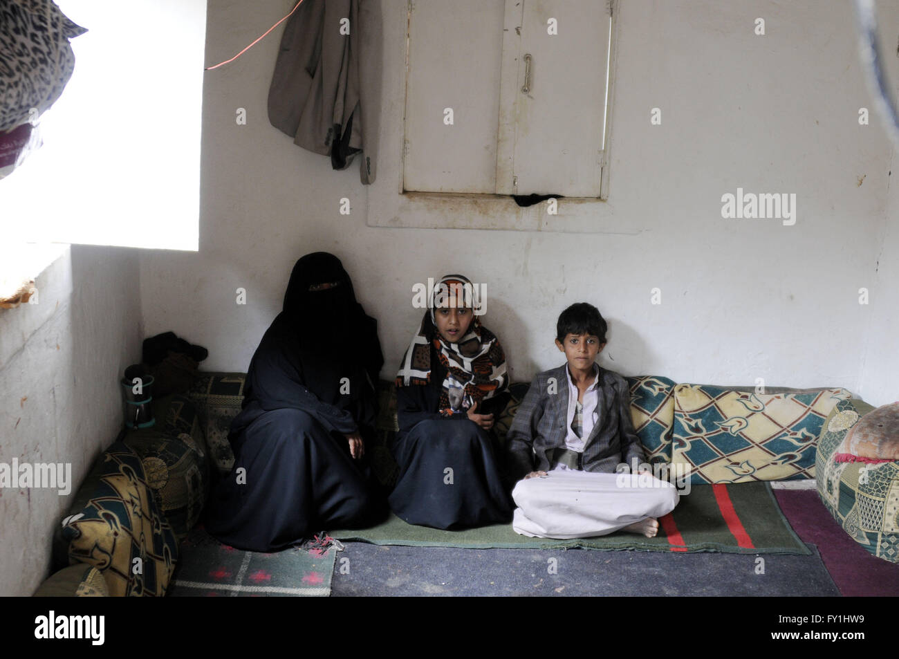 Sanaa, Yemen. 20th Apr, 2016. A woman from a poor family sits with her ...