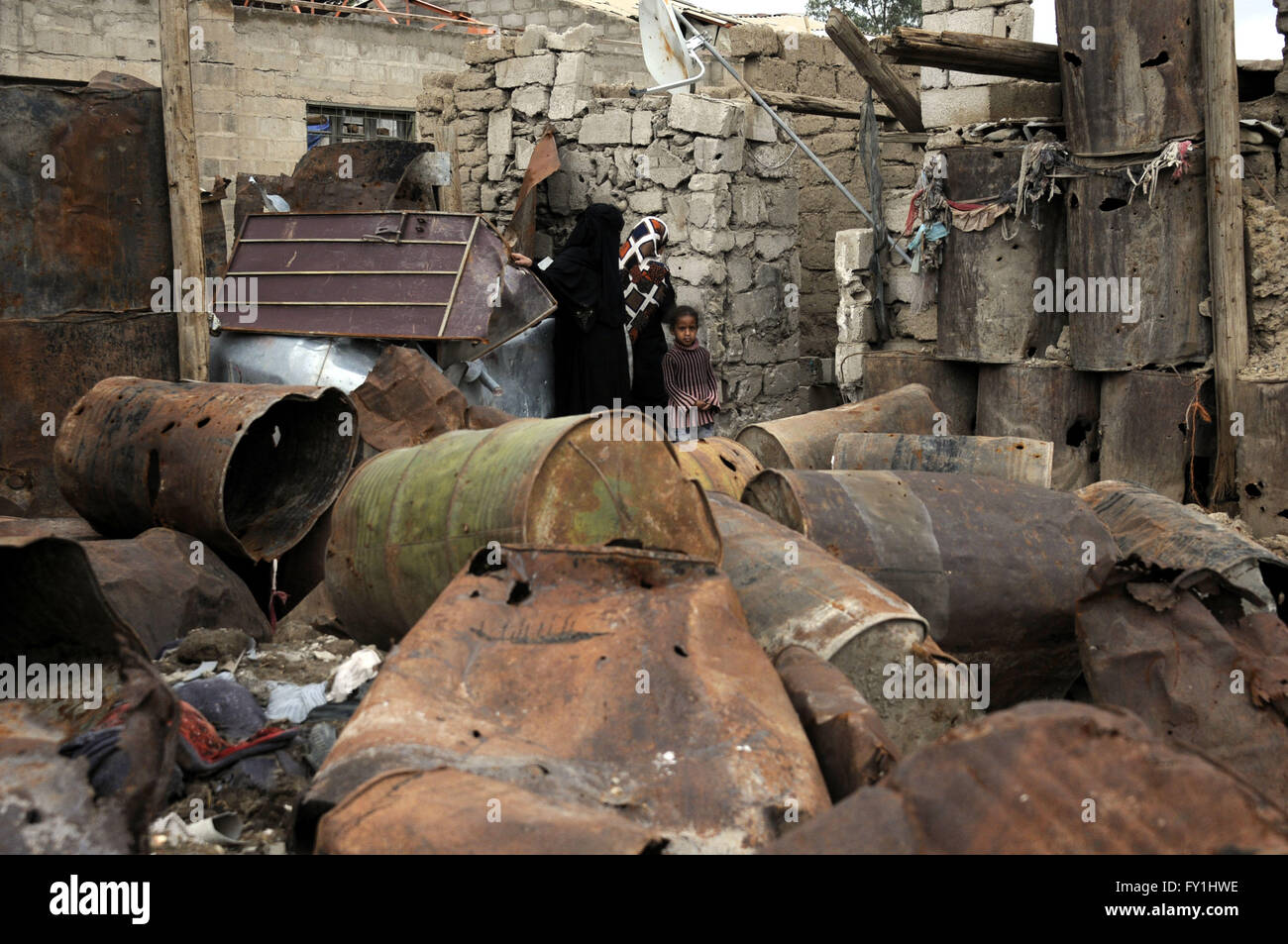 Sanaa, Yemen. 20th Apr, 2016. People from a poor family stand outside ...