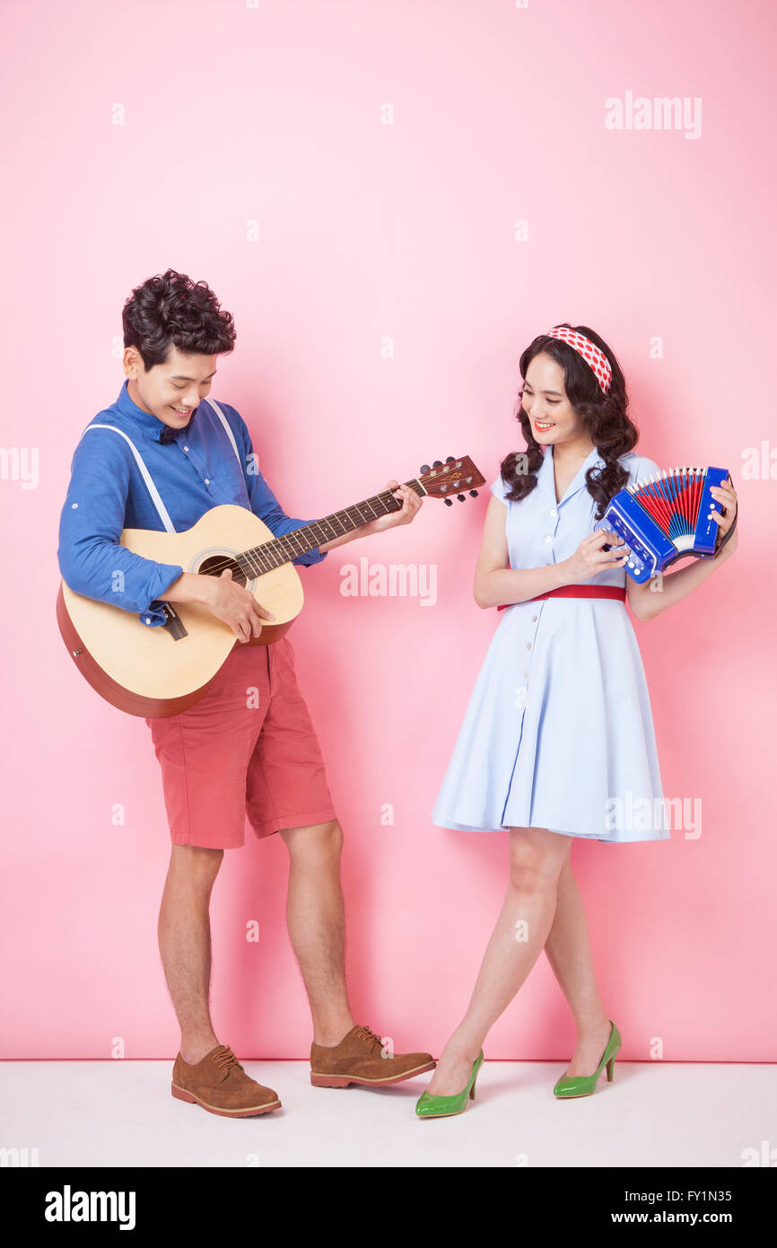 Young man with musical instruments hi-res stock photography and images ...