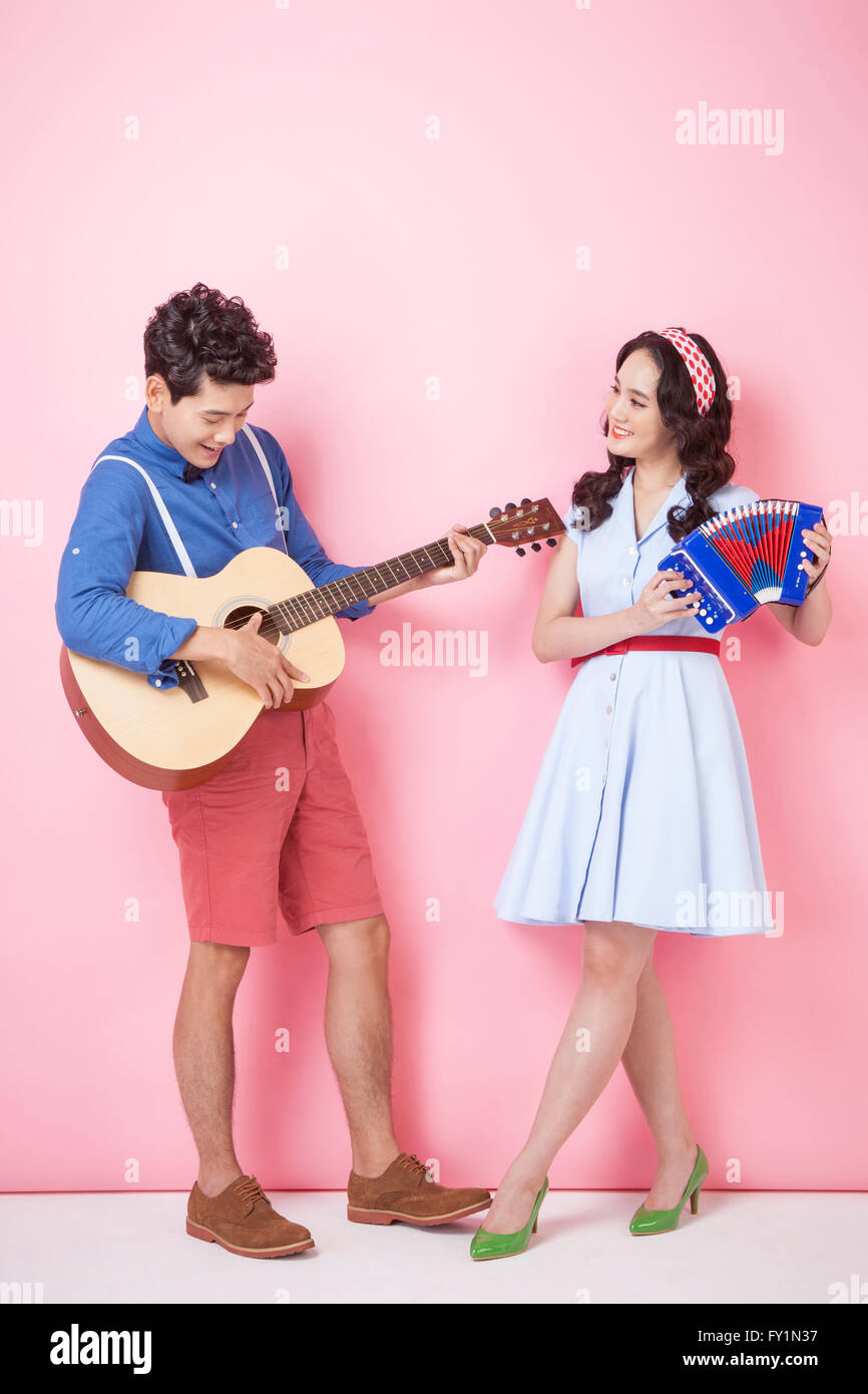 Couple playing musical instruments hi-res stock photography and images ...
